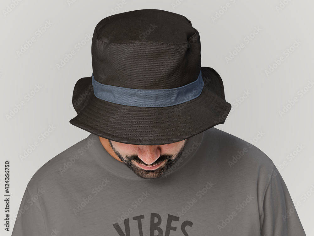 Man wearing bucket hat with minimal design Stock Photo | Adobe Stock