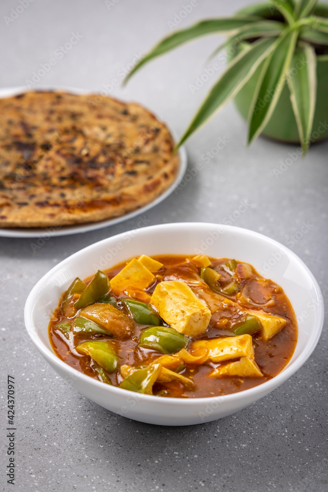 chilli paneer with lacha paratha served for the meal Stock Photo ...