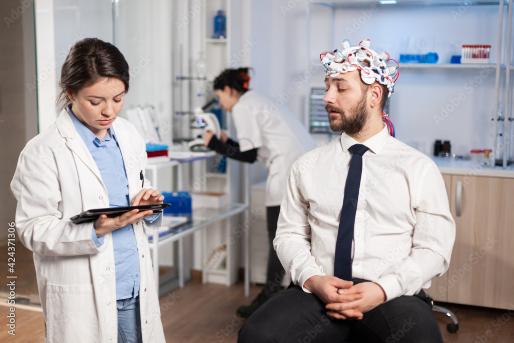 Neuroscience doctor using tablet pc treatment against brain disease ...