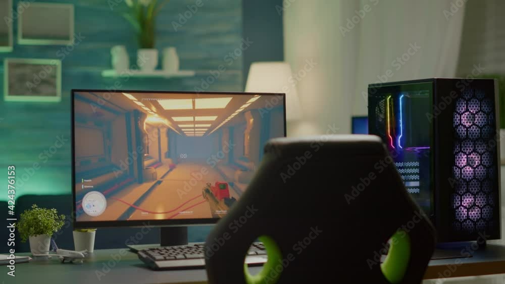 RGB powerful personal computer gamer rig with first-person shooter game ...