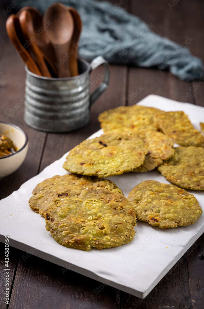 crispy and salty mathri with mango pickle on a white tray Stock Photo ...