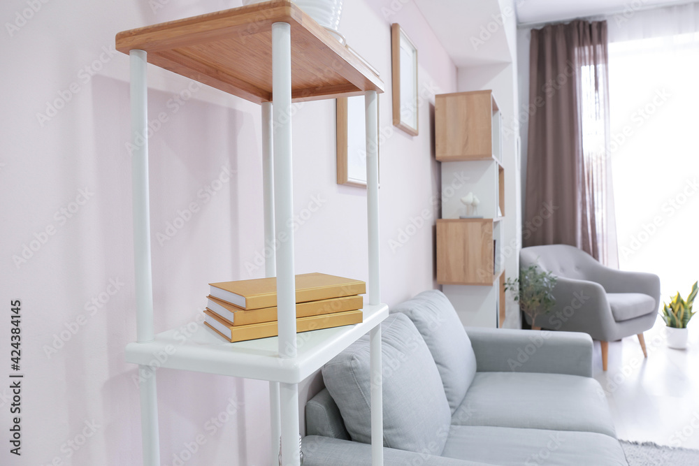 Interior of modern living room with shelf unit and cozy sofa Stock ...
