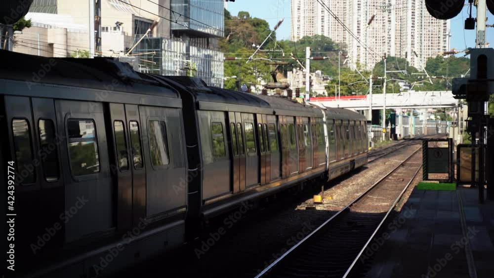MTR Subway Train in Railway Tracks Departing Station in Hong Kong with ...