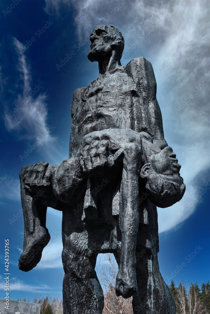 Khatyn, Belarus - March 31 2021: "The Unsubdued Man" depicts the only ...