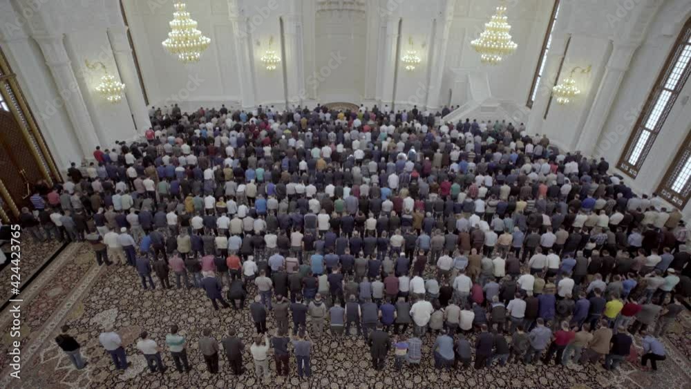Men attend Friday prayers at a mosque during Ramadan. Muslim pilgrims ...