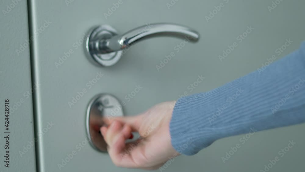 A Woman's Hand Inserts the Key into the Door Lock in the Door and Turns ...
