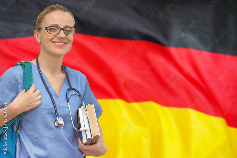 Female student doctor with stethoscope and books in hand on the Germany ...
