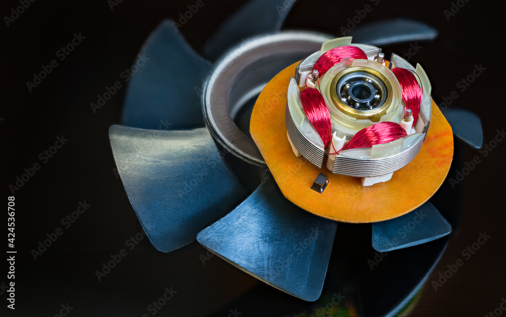 Integrated hall sensor in computer fan rotor and plastic vanes on a ...