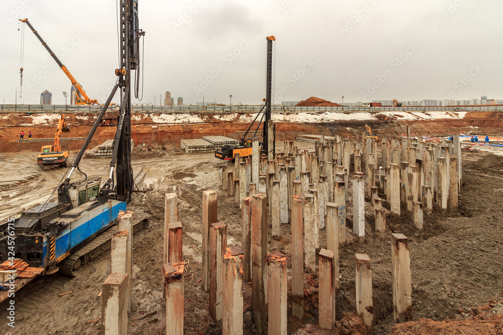 Pile driving in foundation pit for construction of apartment building ...