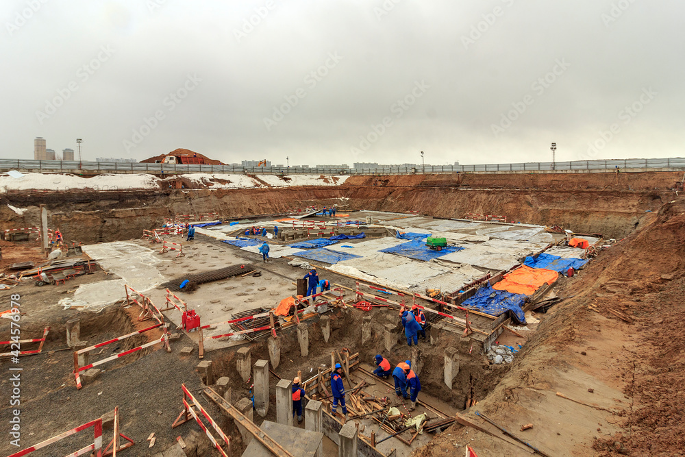 Pile driving in foundation pit for construction of apartment building ...