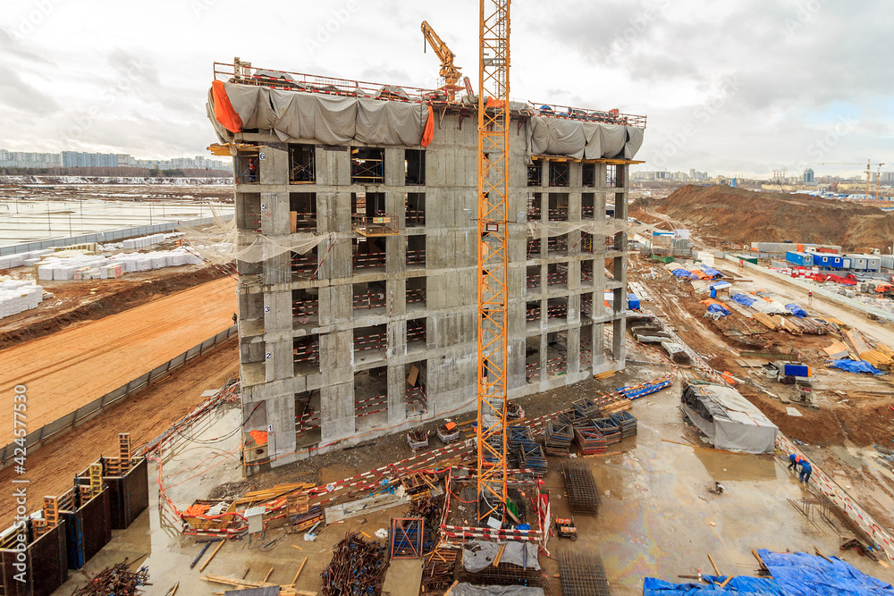 Construction of a monolithic house. Stylobate. Sunny snowy winter day ...