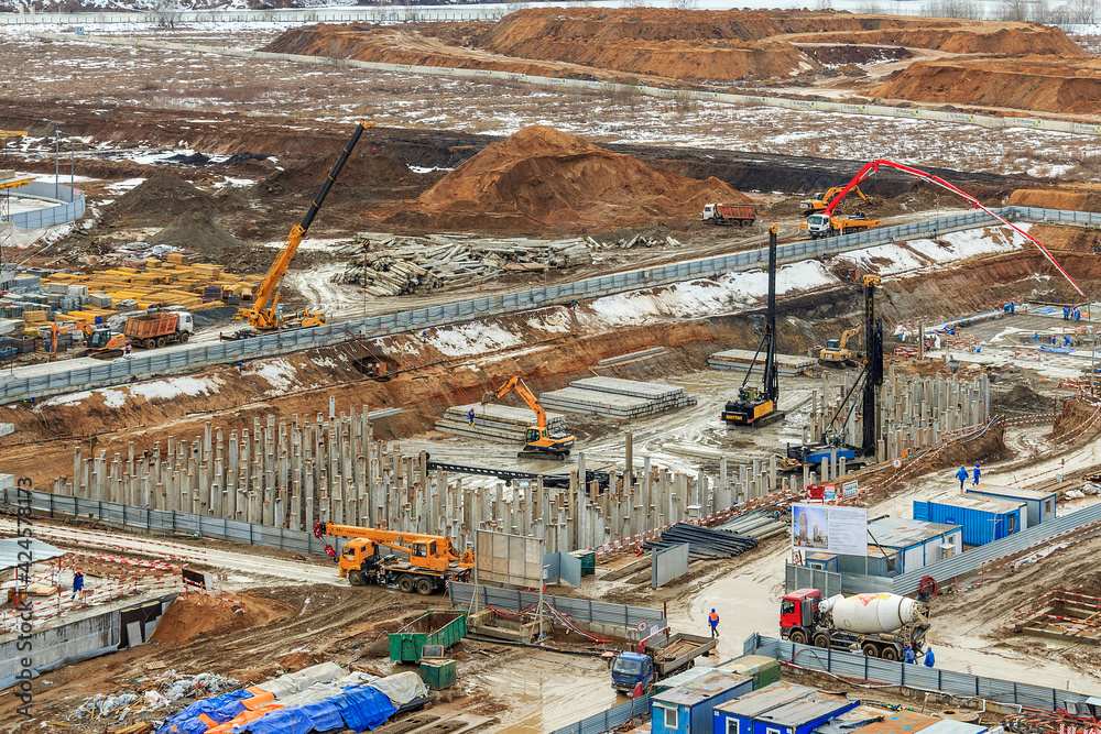 Pile driving in foundation pit for construction of apartment building ...