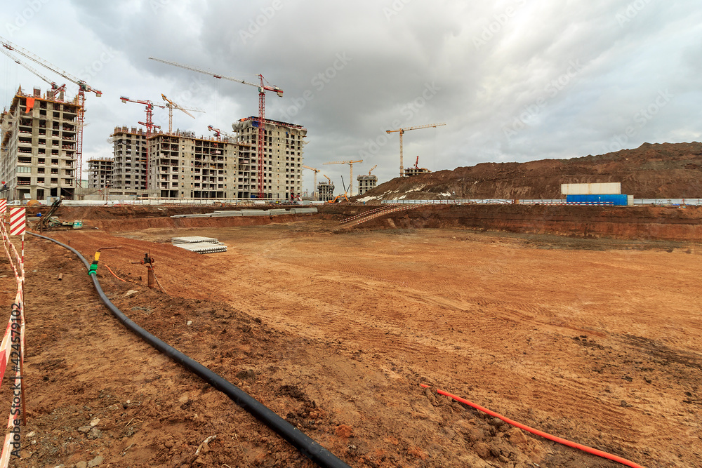 Reinforced concrete piles of new building, tower crane. Hydraulic ...