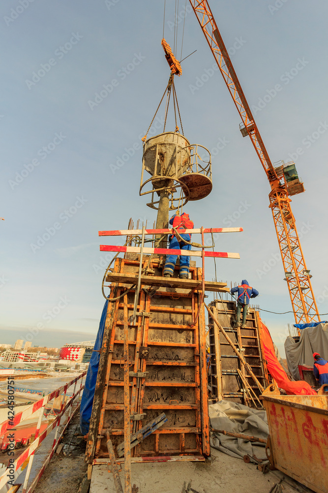 Reinforcement work, installation of formwork. Concrete is poured in ...
