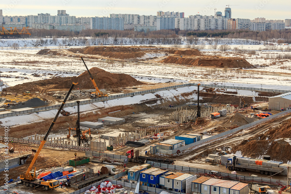 Reinforced concrete piles of new building, tower crane. Hydraulic ...