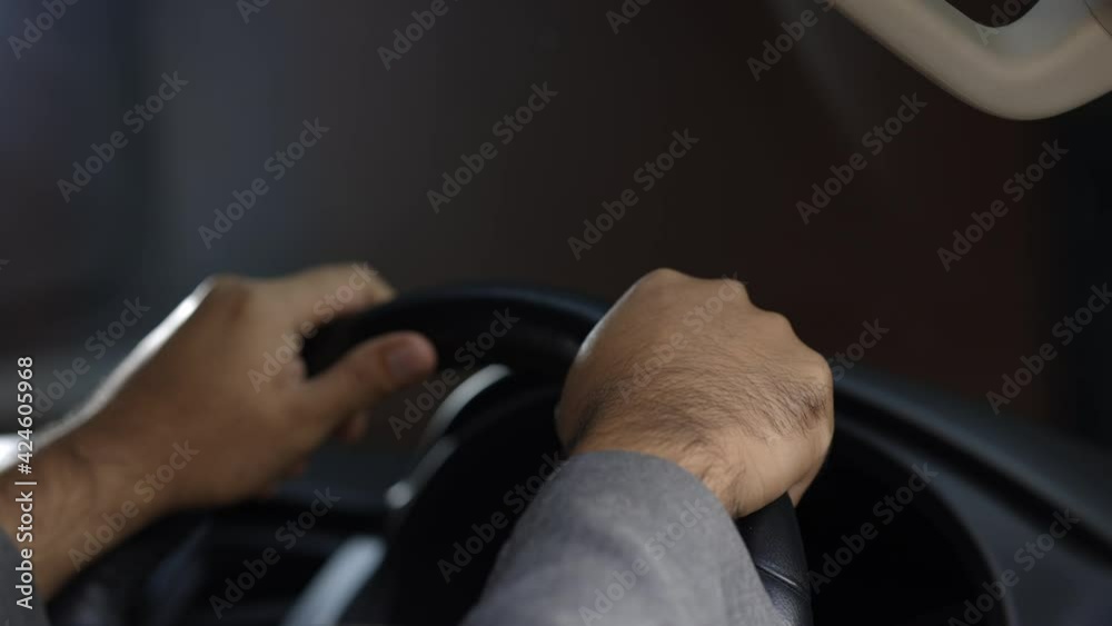 The businessman in suit his hand is holding the steering wheel of the ...