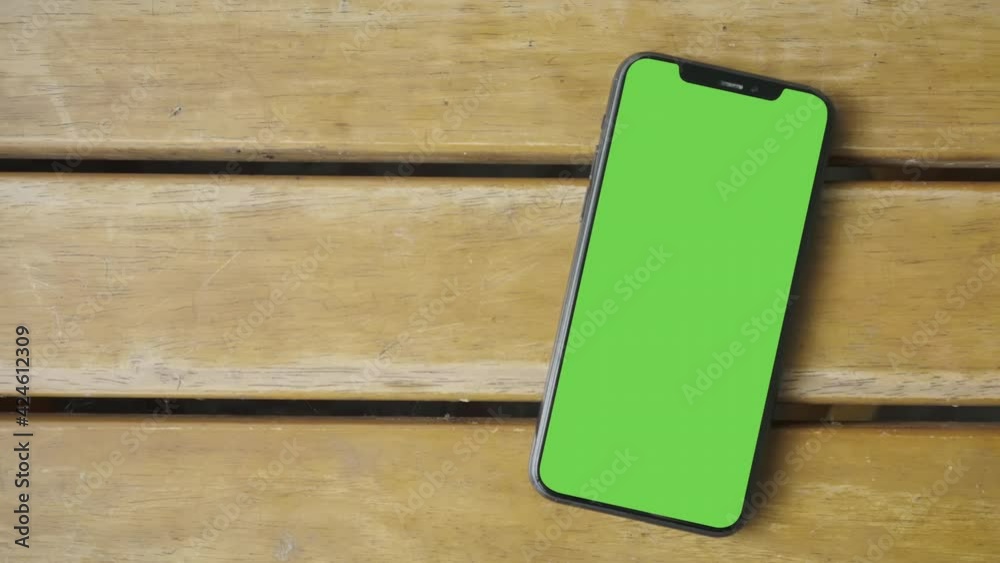 Smart phone place on table wood, Green screen telephone, Close up ...