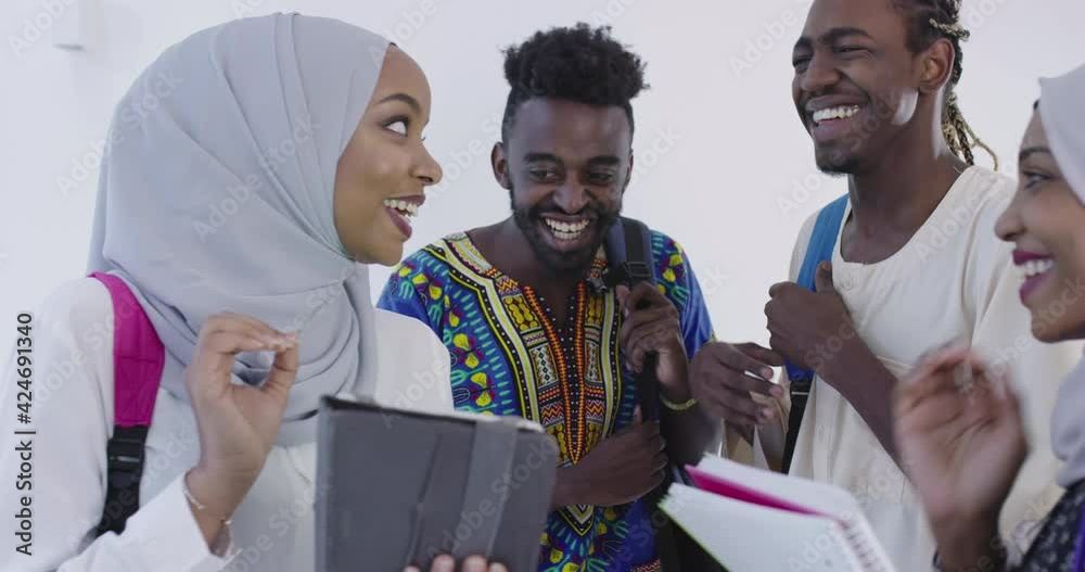 African students in traditional clothes planing and preparing for ...