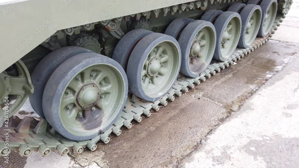 Tank wheels close-up. Iron tracks of a heavy military tank. Iron ...