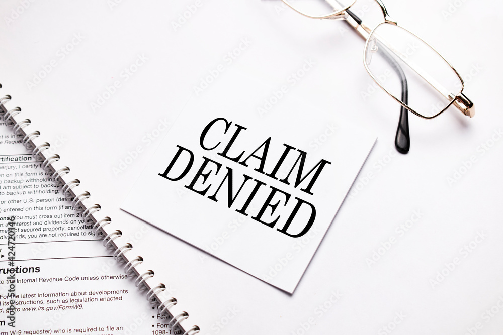 Business concept. Notebook with text Claim Denied sheet of white paper ...