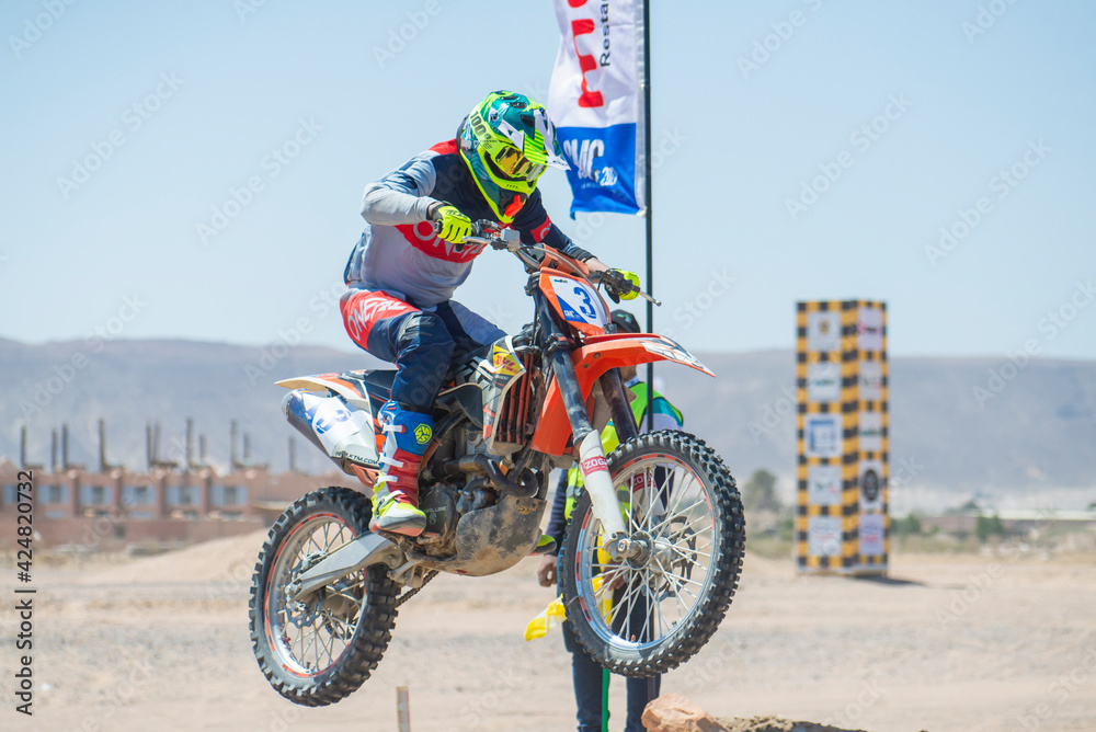 Off-road dirt bikes competing in a desert motocross rally Stock Photo ...