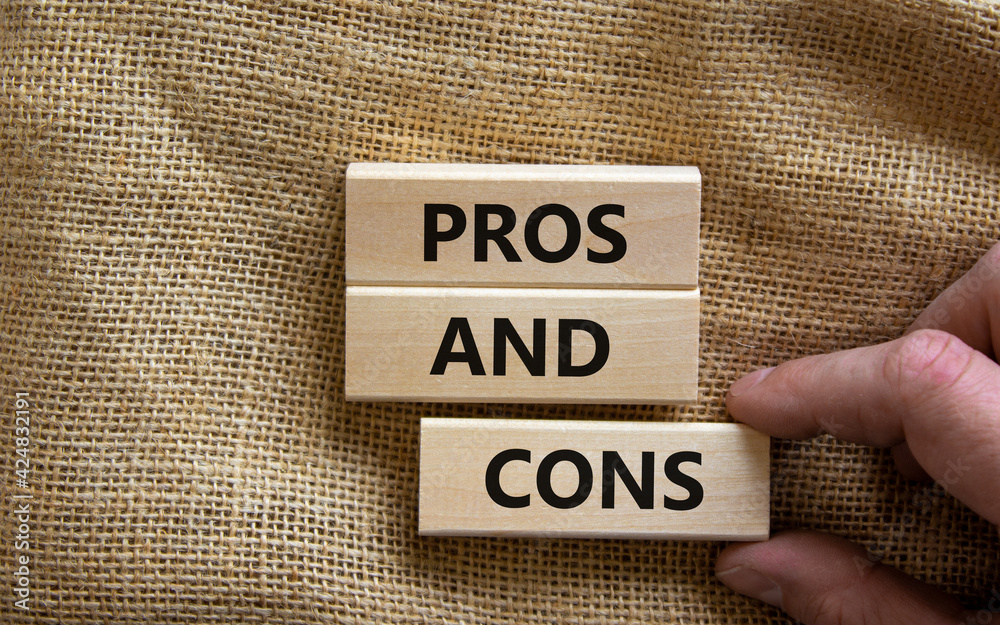 Pros and cons symbol. Wooden blocks with words 'Pros and cons ...