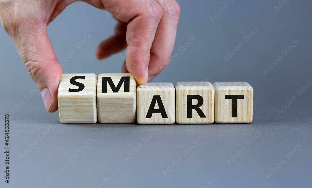 Smart art symbol. Businessman turns cubes and changes the word 'smart ...