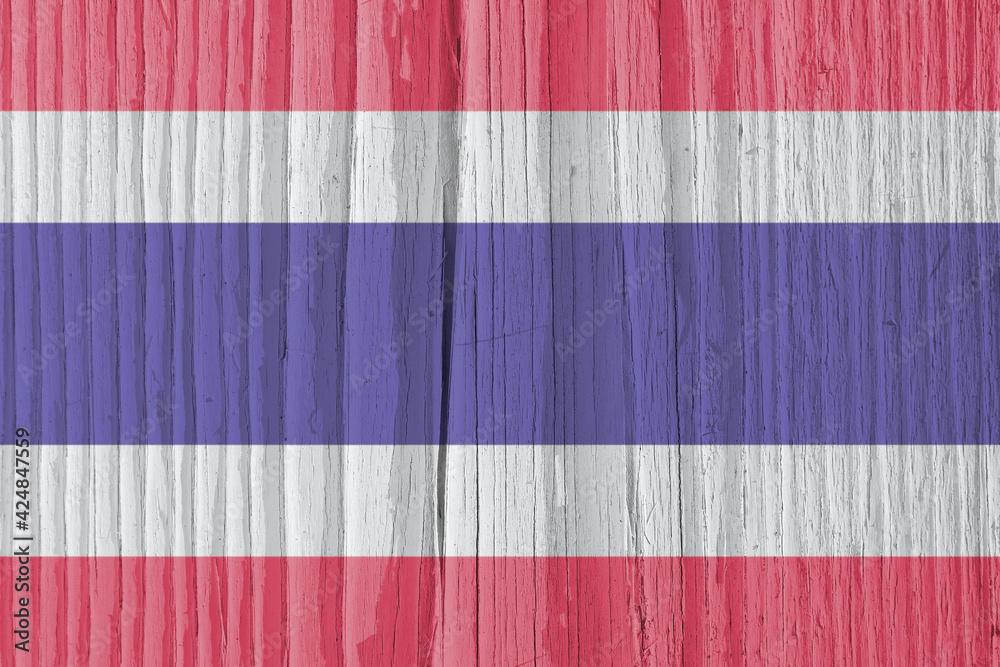 The flag of Thailand on dry wooden surface, cracked with age. Light ...