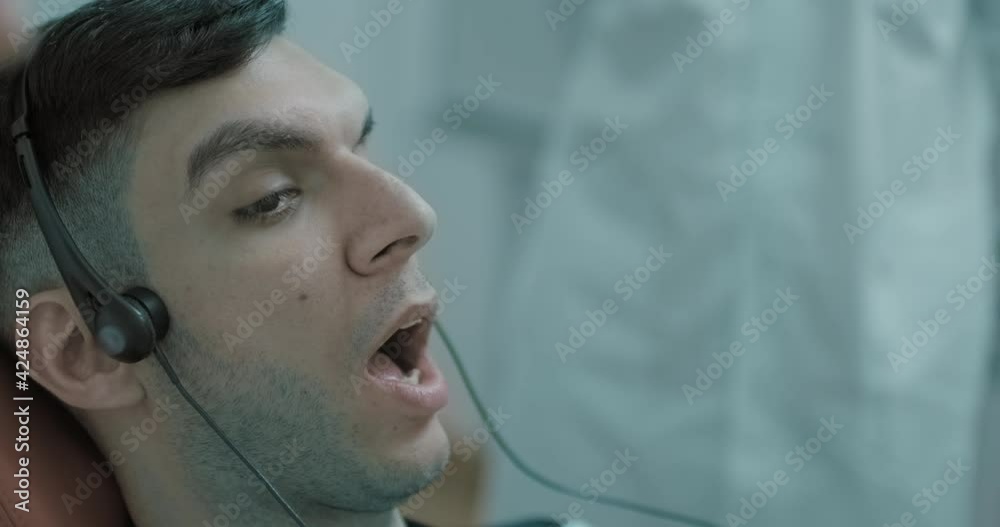 Close up Face Of An Arabian Male Patient With An Open Mouth Who Is Close up Face Of An Arabian Male Patient With An Open Mouth Who Is