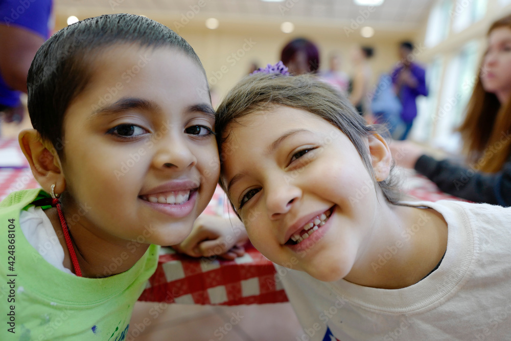 Happy preschool age girls closeup enjoying different indoors activities ...