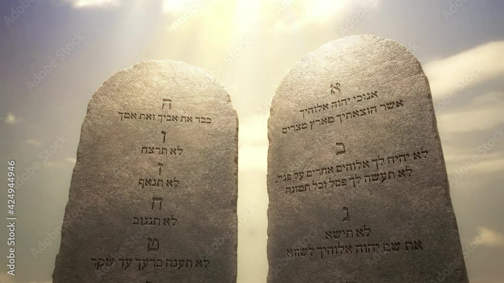 Golden letters of the Ten Commandments on the stone tablets. God told ...