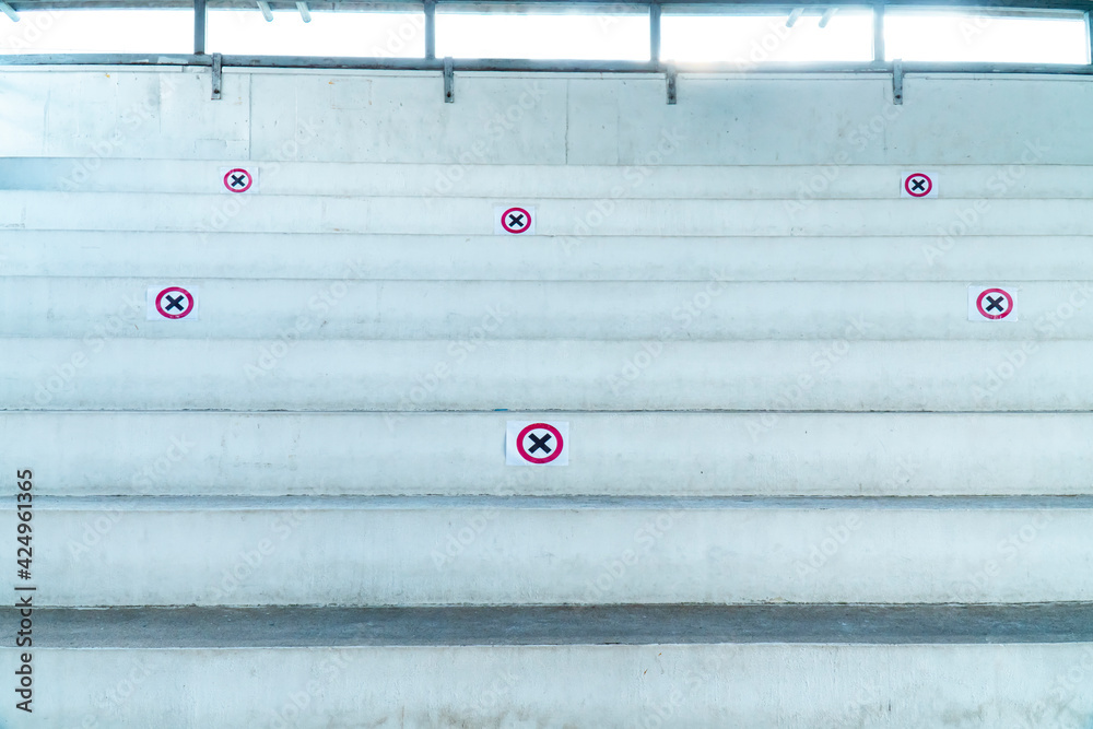 Grandstand stadium with cross sign for social distancing sitting ...