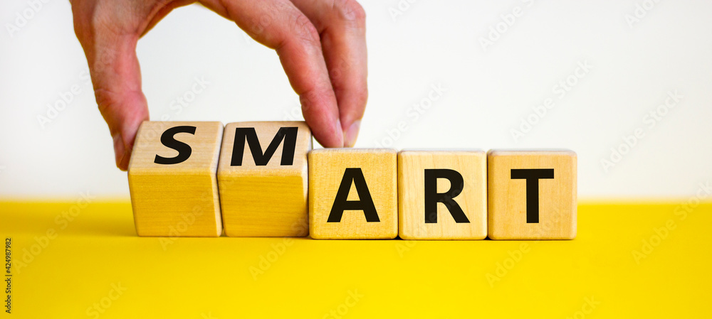 Smart art symbol. Businessman turns cubes and changes the word 'smart ...