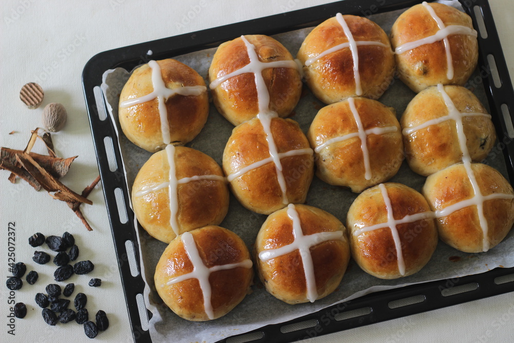 Freshly baked hot cross buns. A sweet fruit bun lightly spiced with ...