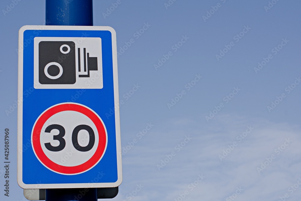 UK road sign 30mph speed limit sign with a speed camera warning. Stock ...