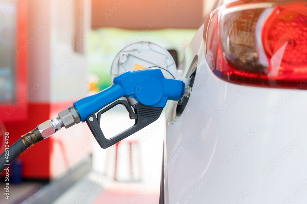 Refill and filling Oil Gas Fuel at station. Gas station - refueling. To ...