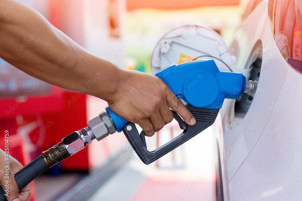 Hand Man Refill and filling Oil Gas Fuel at station. Gas station ...