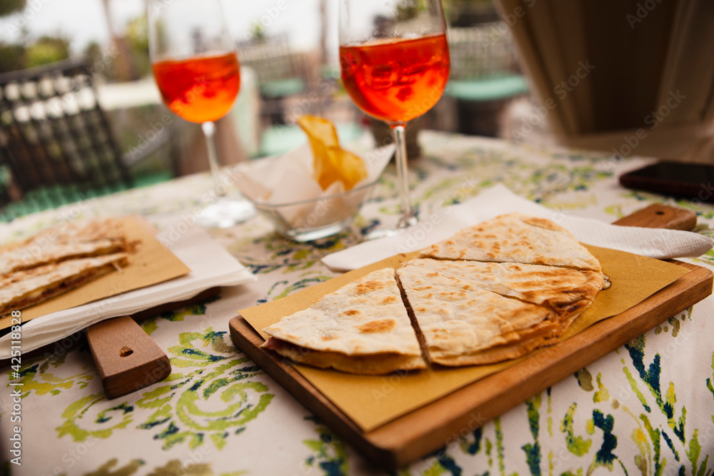 Italian traditional street food and aperitif. Aperol spritz with ...