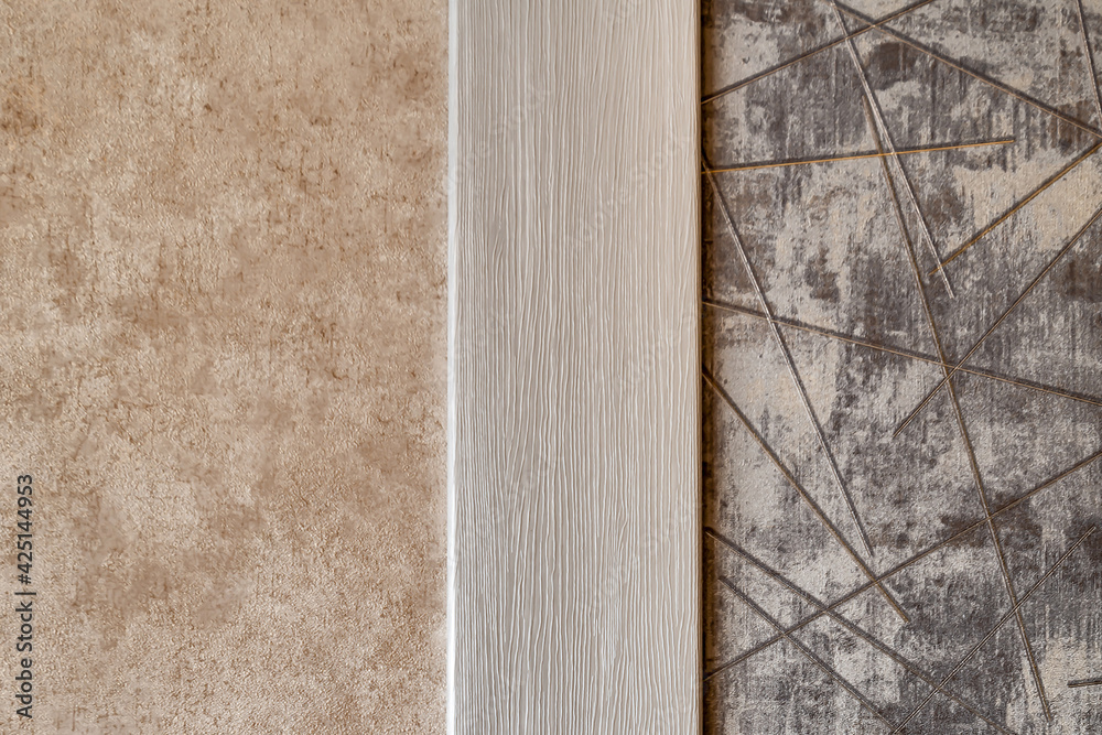 concrete with reinforcement and pink wallpaper separated by a white ...