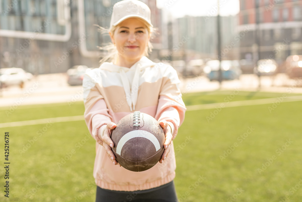 Beautiful girl rugby player in stadium. Stock Photo | Adobe Stock