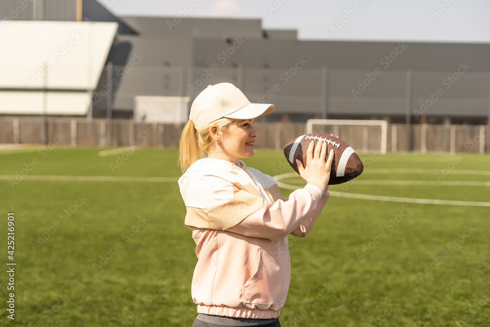 Beautiful girl rugby player in stadium. Stock Photo | Adobe Stock