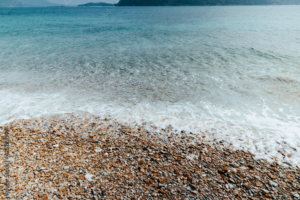 beautiful soft wave clear blue transparency sea ocean water and rocks ...