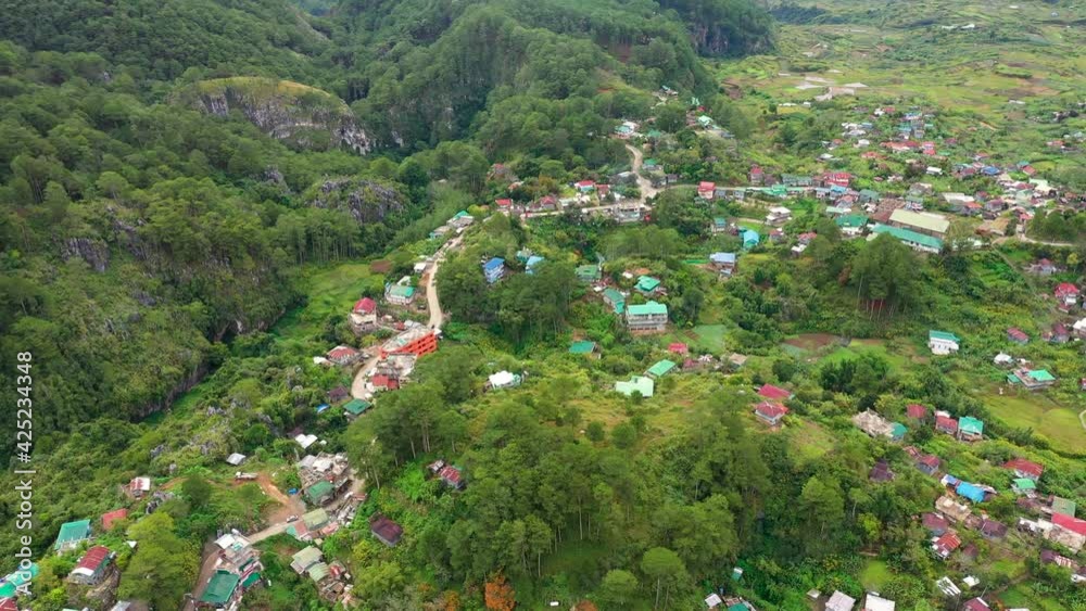 The town is surrounded by mountains, a top view. Sagada city on Luzon ...