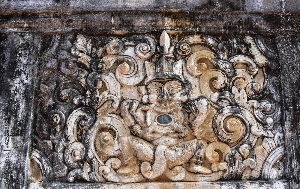 Stucco figures around Phra That Ing Hang in Savannakhet, Laos. Stock ...