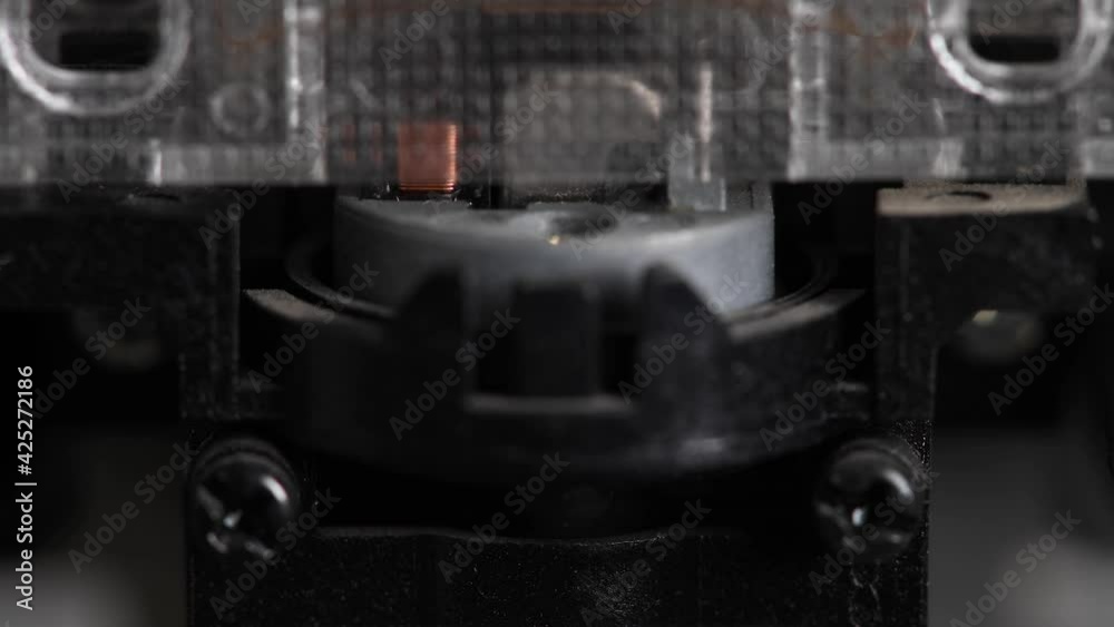 Tape recorder head and roller assembly. Close-up of a reel for a drum ...