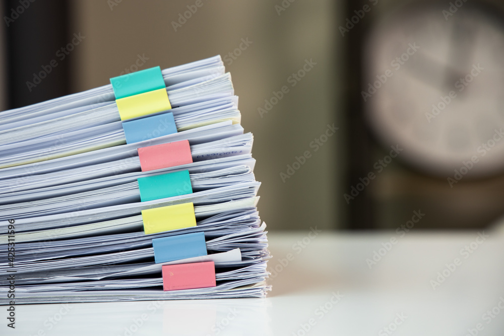 Piles of white papers work large piles of papers stacked together. On ...