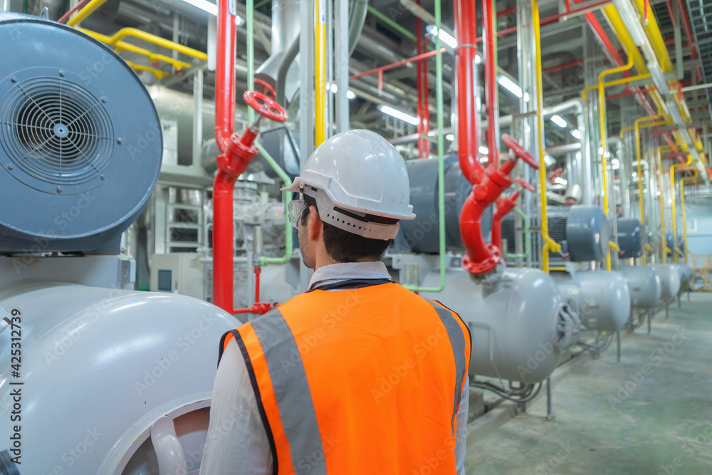 An engineer man or worker, people working in industry factory. Chiller ...
