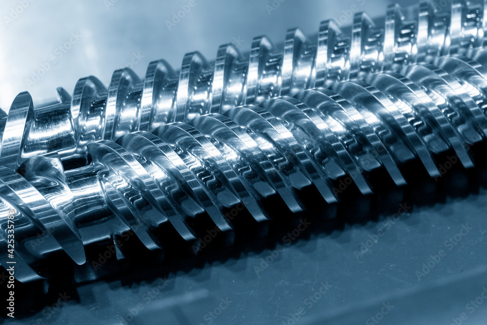 The metal screw spare parts of plastic injection machine. The blending ...