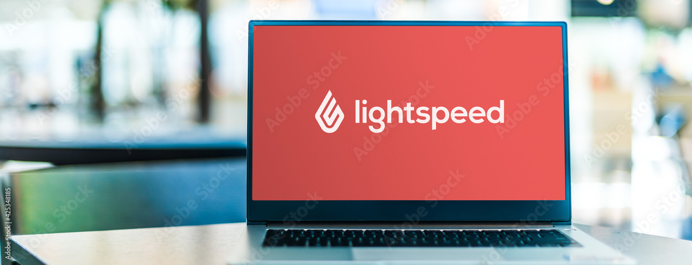 Laptop computer displaying logo of Lightspeed Stock Photo | Adobe Stock
