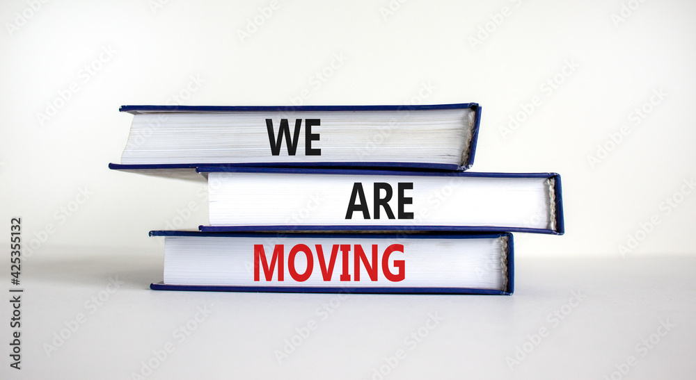 We are moving symbol. Books with words 'We are moving'. Beautiful white ...